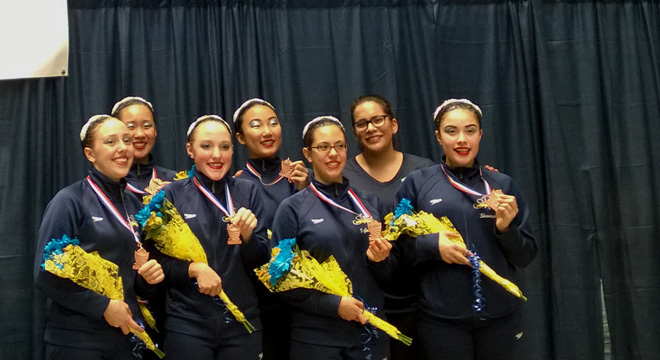 Local girls learn what it takes to be a synchronized swimmer